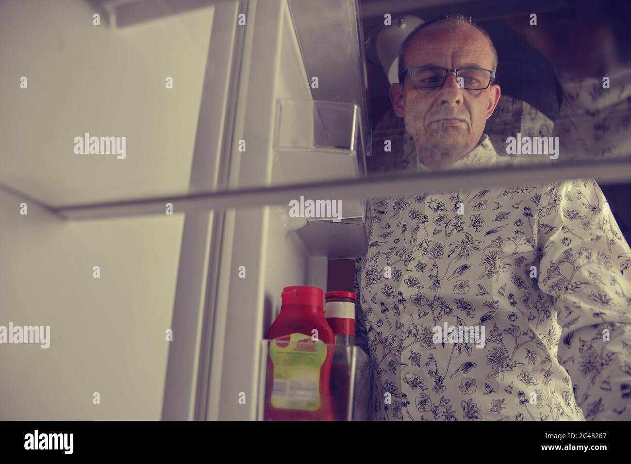 View from inside fridge man hi-res stock photography and images - Alamy