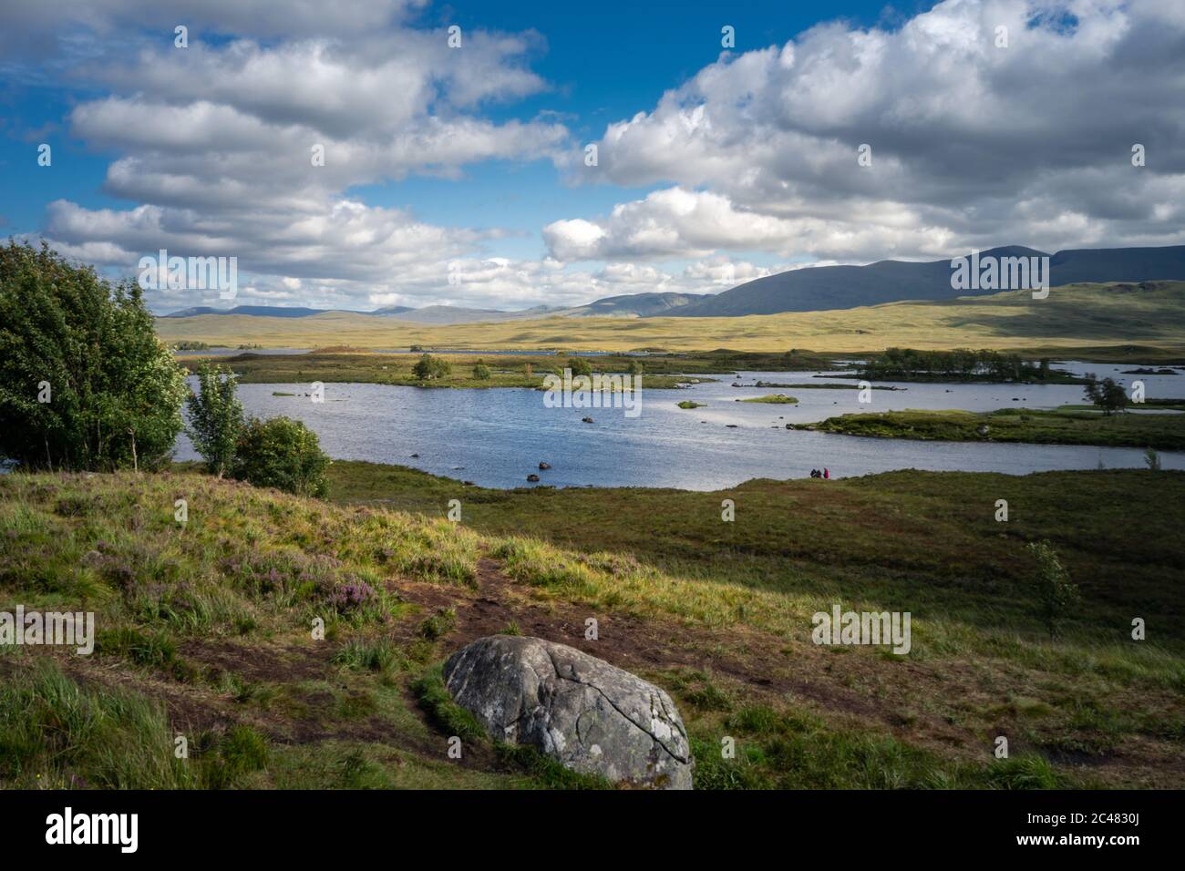 Lake Loch Tulla surrounded by mountains and meadows in the UK Stock ...