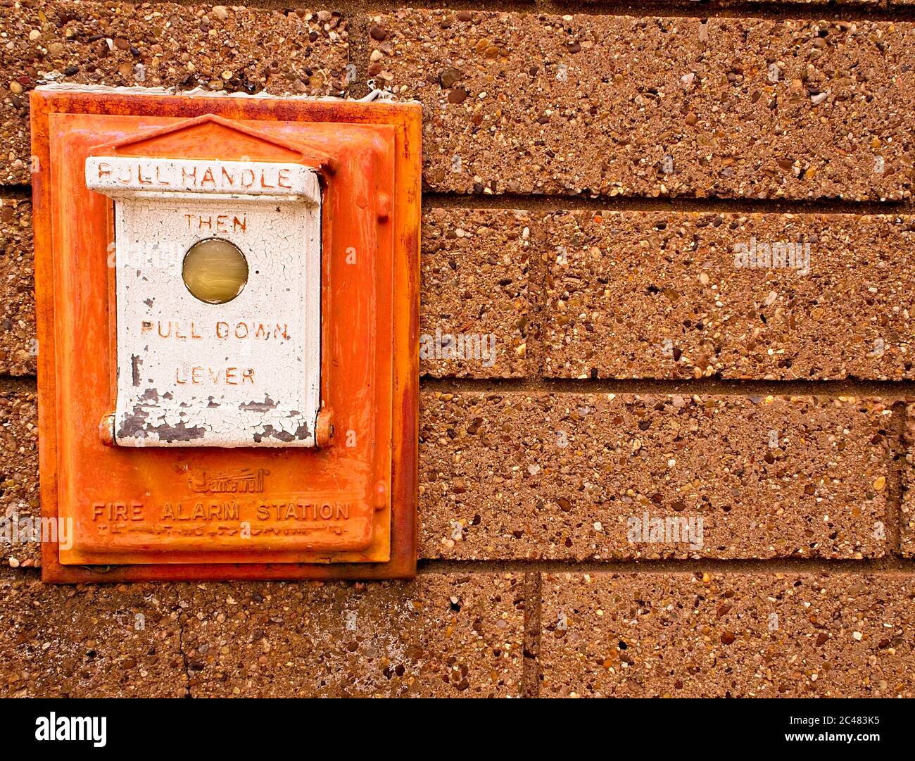 fire alarm on the side of a building Stock Photo - Alamy