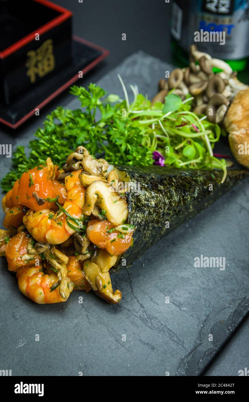 Temaki sushi. Traditional Japanese cuisine, premium Temaki of mushrooms ...