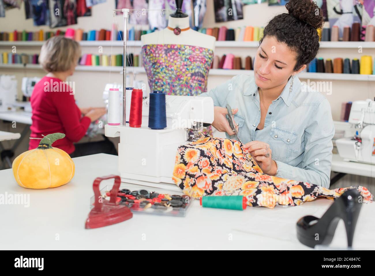young woman working sewing machine Stock Photo - Alamy