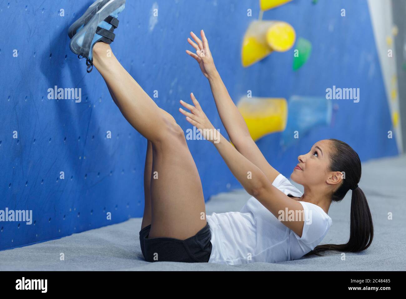 woman fell from wall climbing Stock Photo - Alamy