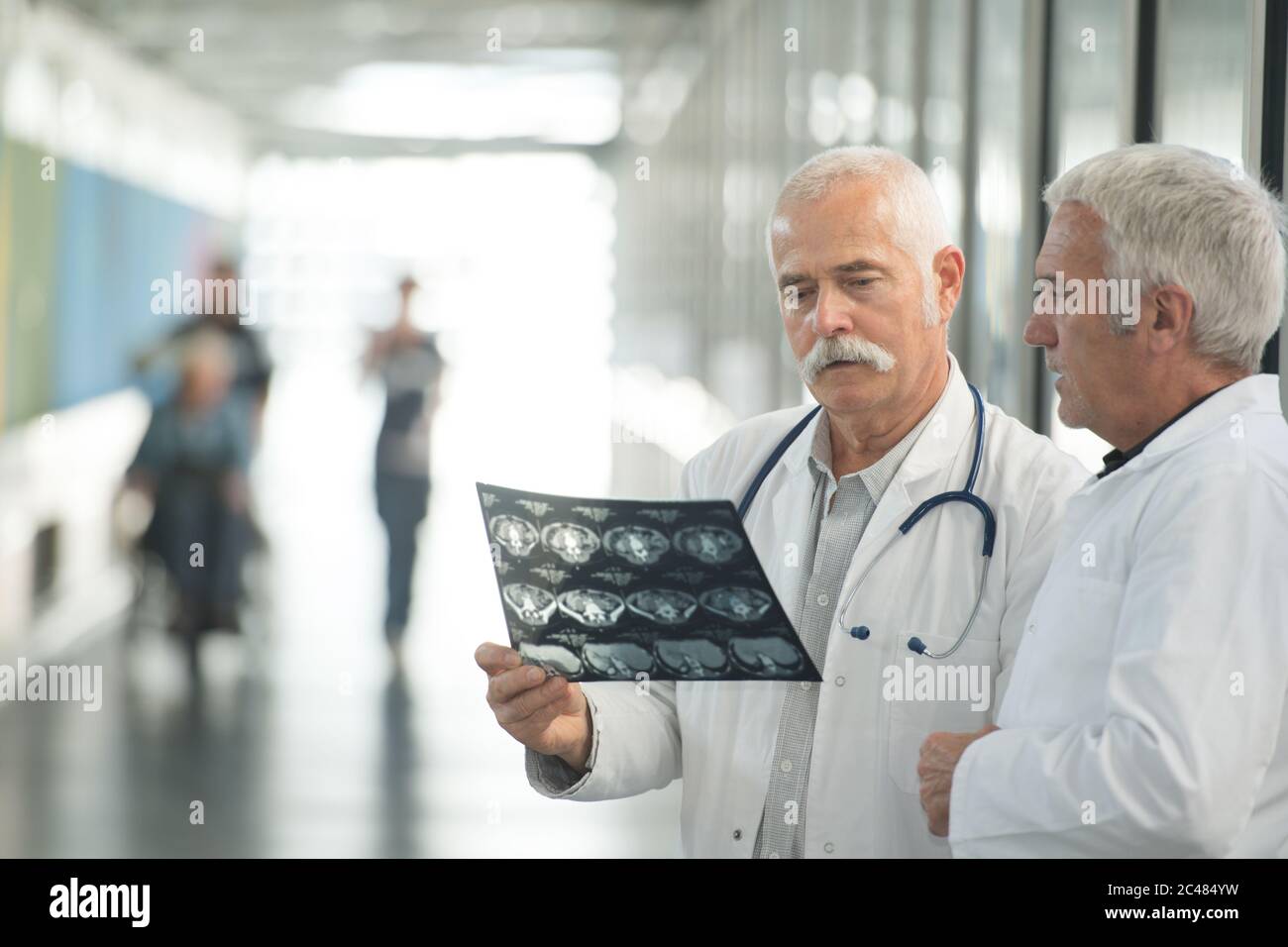 confident doctors holding xray report in hospital Stock Photo - Alamy