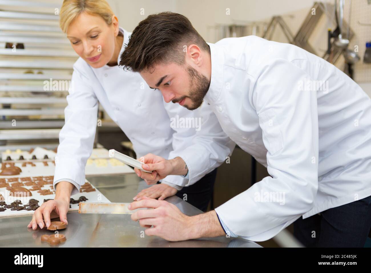 artisan chocolate making mold casting Stock Photo - Alamy