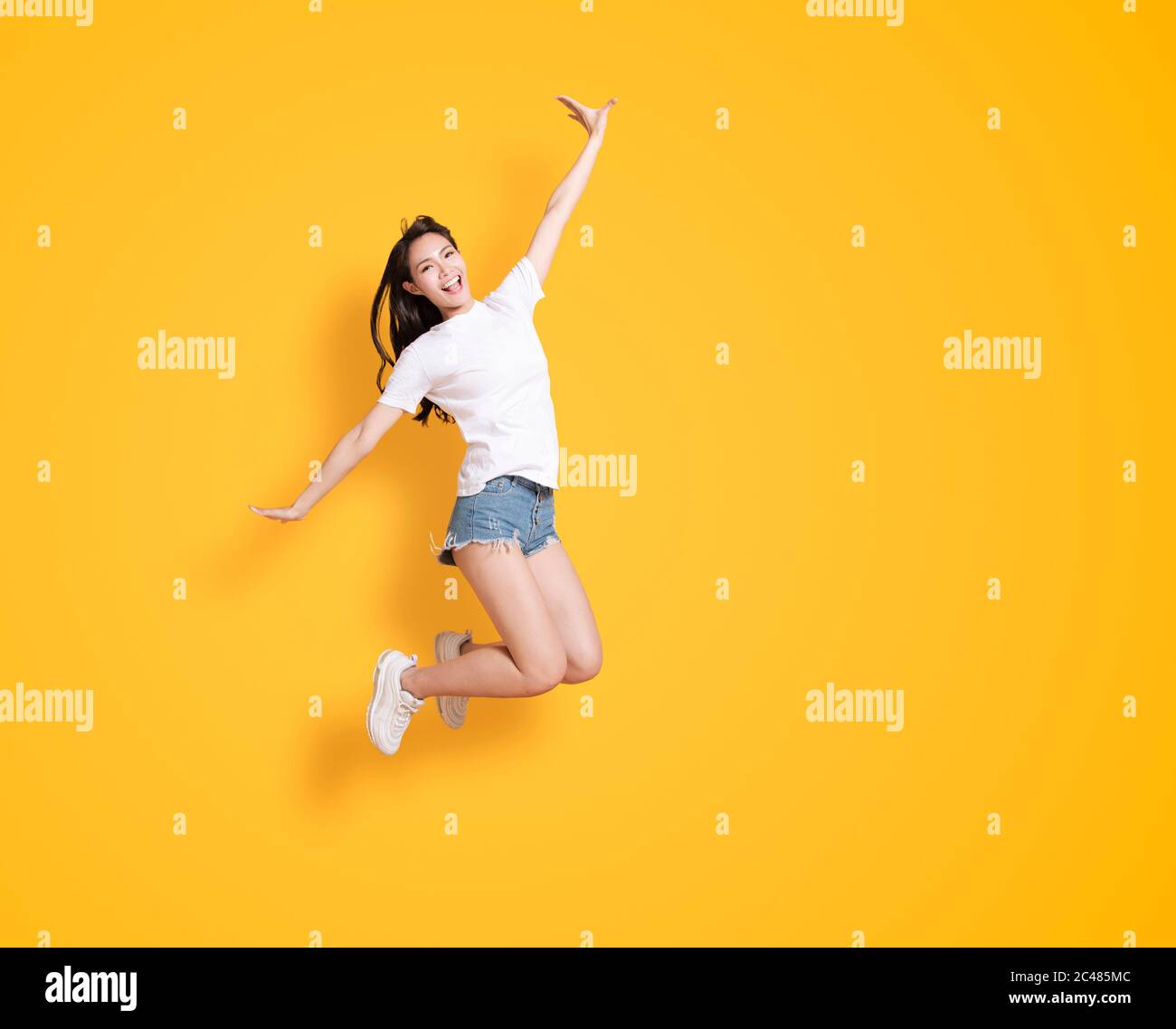 Asian girl jumping isolated over hi-res stock photography and images ...