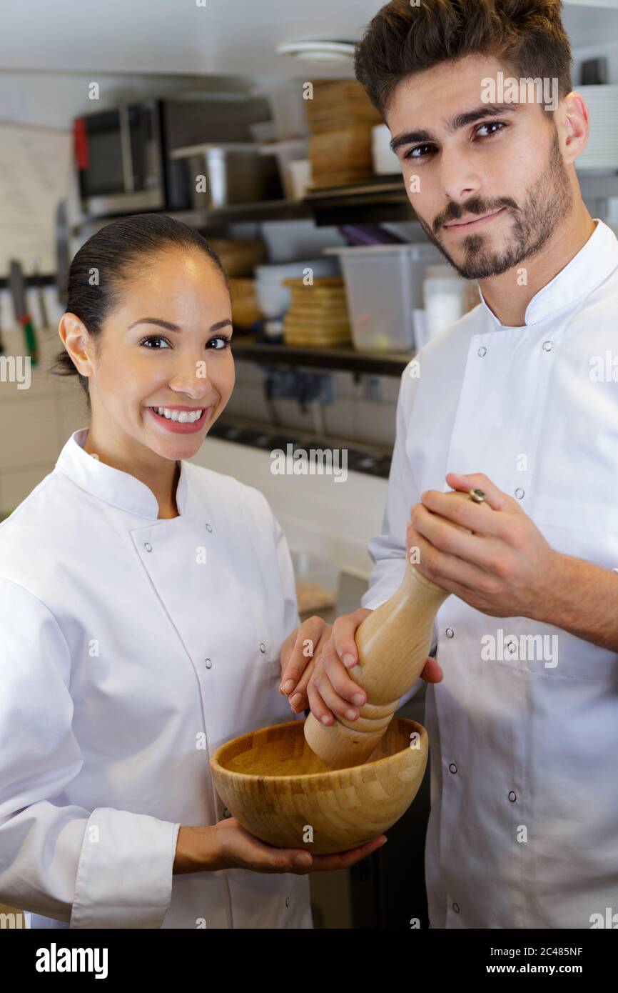 happy female and male chef with cooking utensils Stock Photo - Alamy