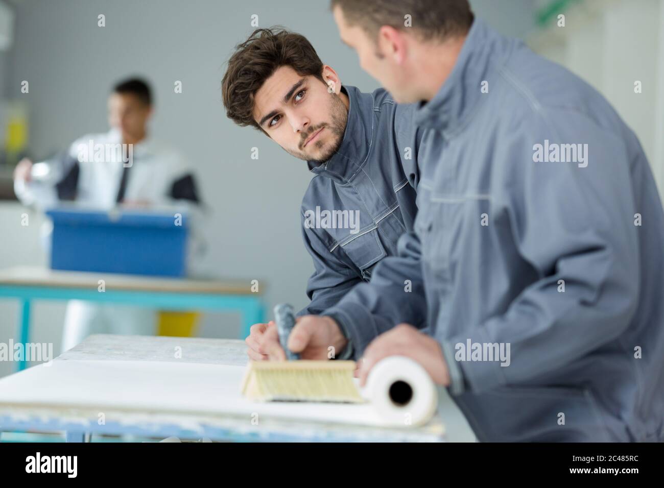 decorating team painting a room Stock Photo - Alamy