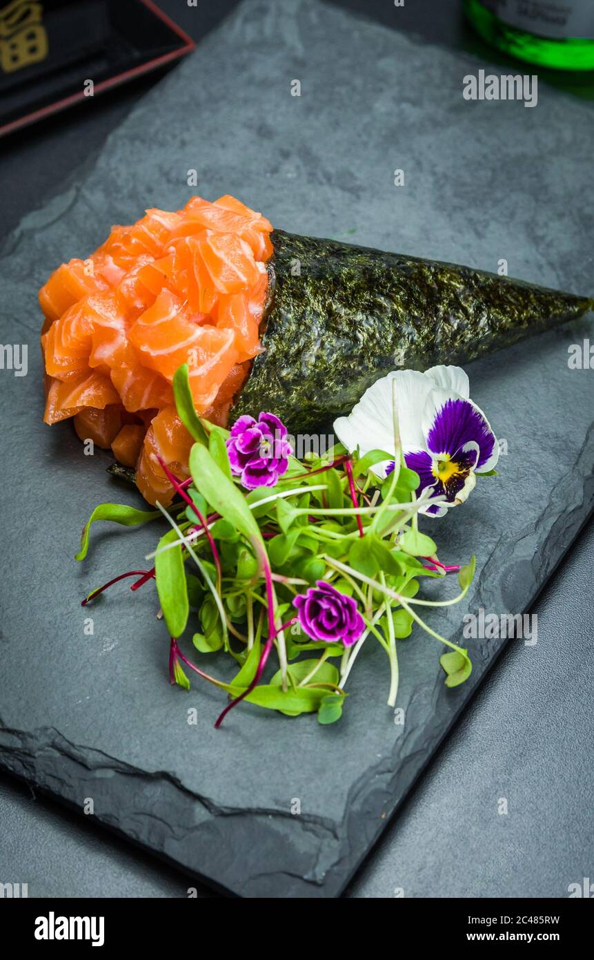 Sushi. Traditional Japanese cuisine, premium salmon Temaki decorated in ...