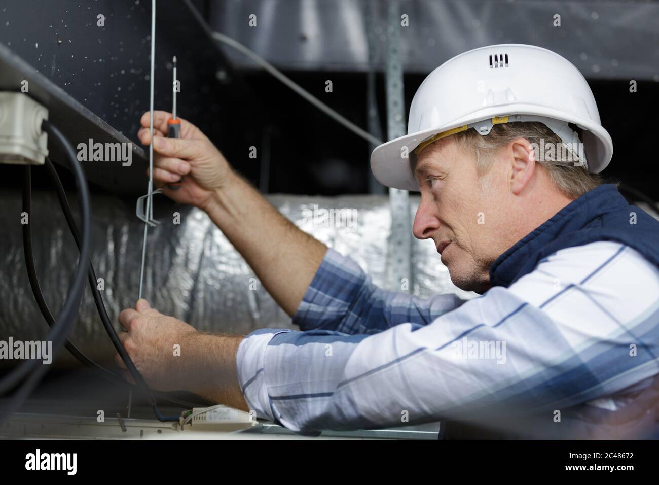 Electrical engineer performs installation hi-res stock photography and ...