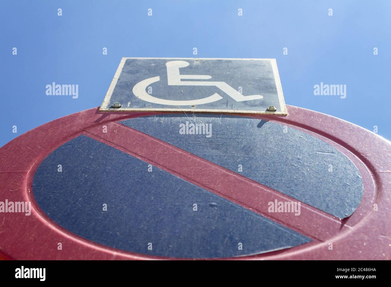 Low angle closeup shot of no parking sign with the exception for ...