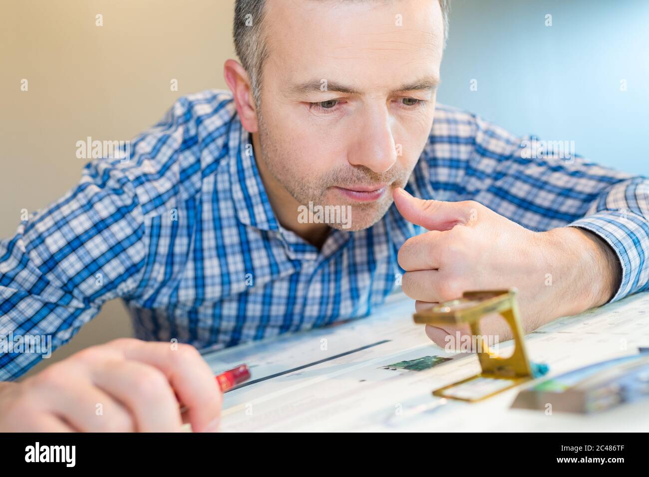 man in the process of offset printing and color correction Stock Photo ...