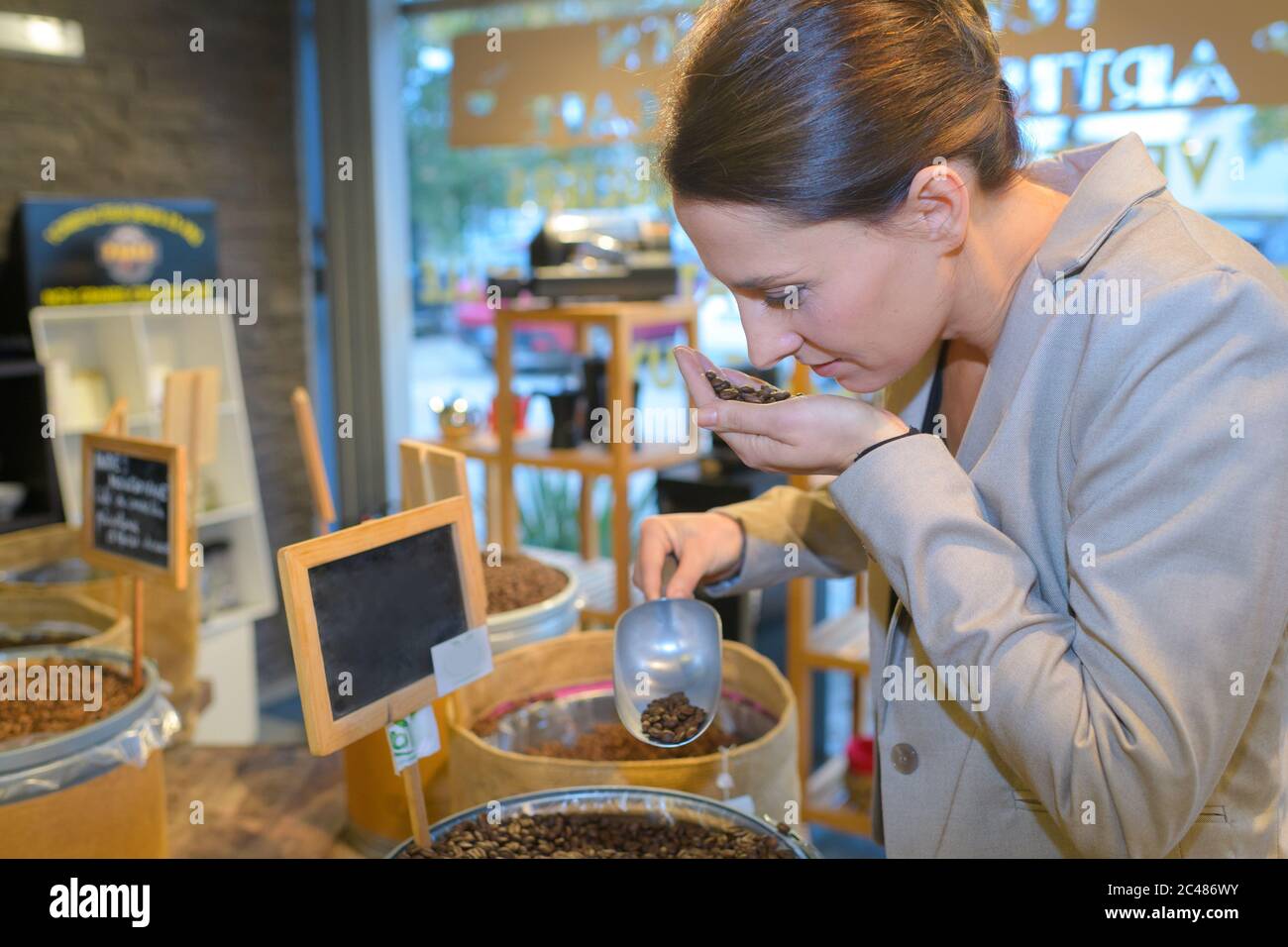 Worker checking roasted coffee beans hi-res stock photography and ...
