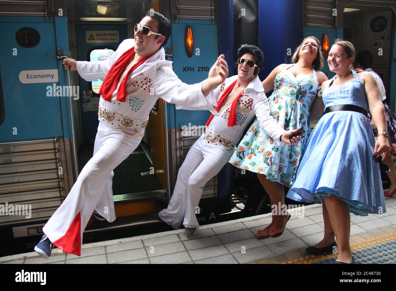 People board the Elvis Express train at Sydney’s Central Station to the ...
