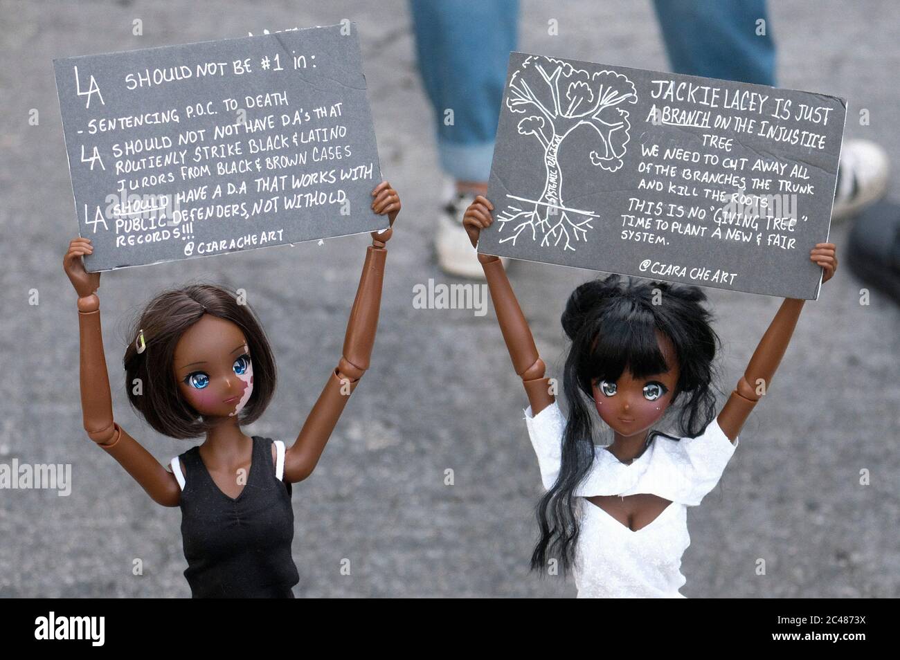 Los Angeles, California, USA. 24th June, 2020. Dolls holding signs as ...
