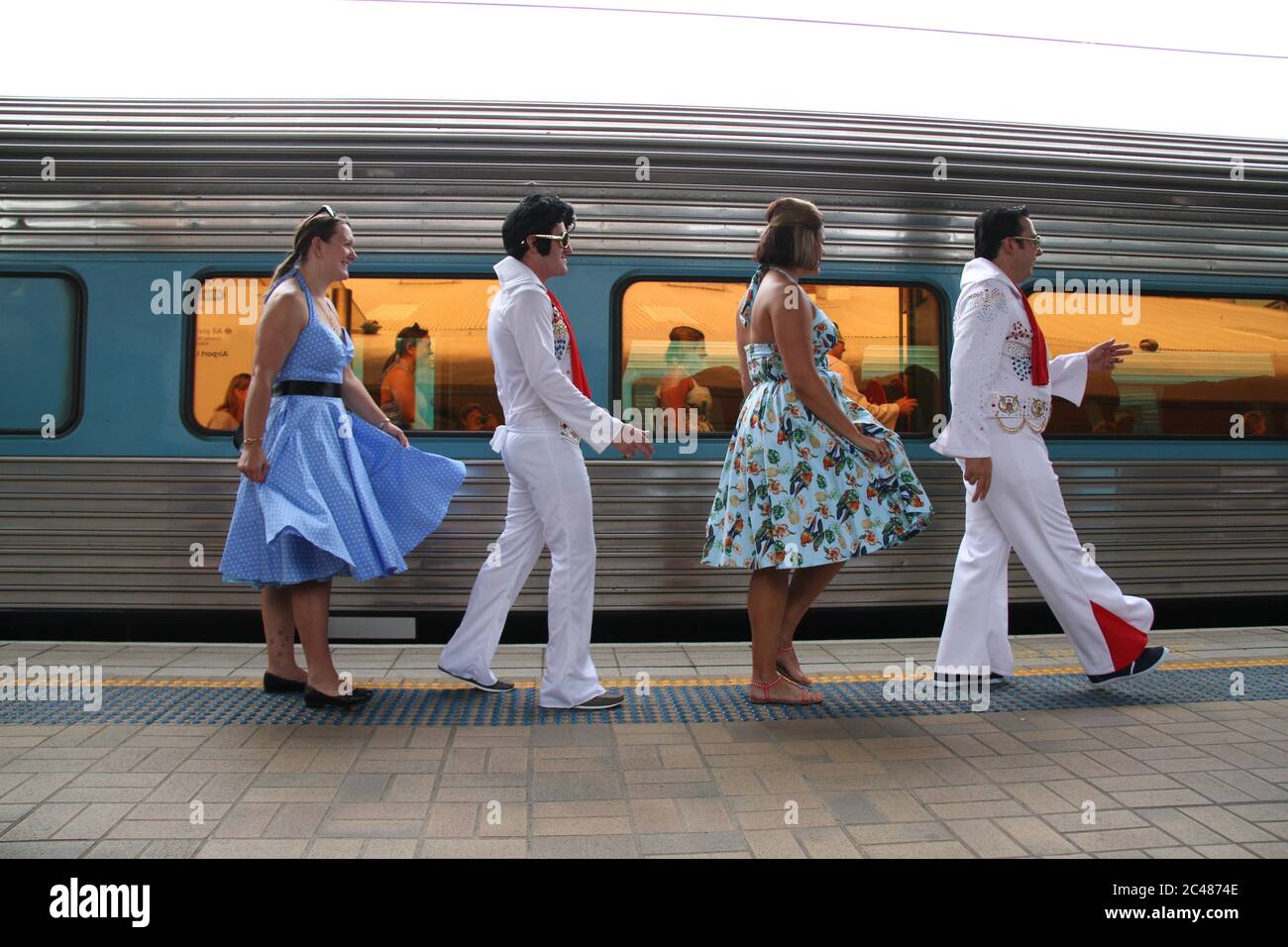 People board the Elvis Express train to the 2014 NSW TrainLink Parkes ...