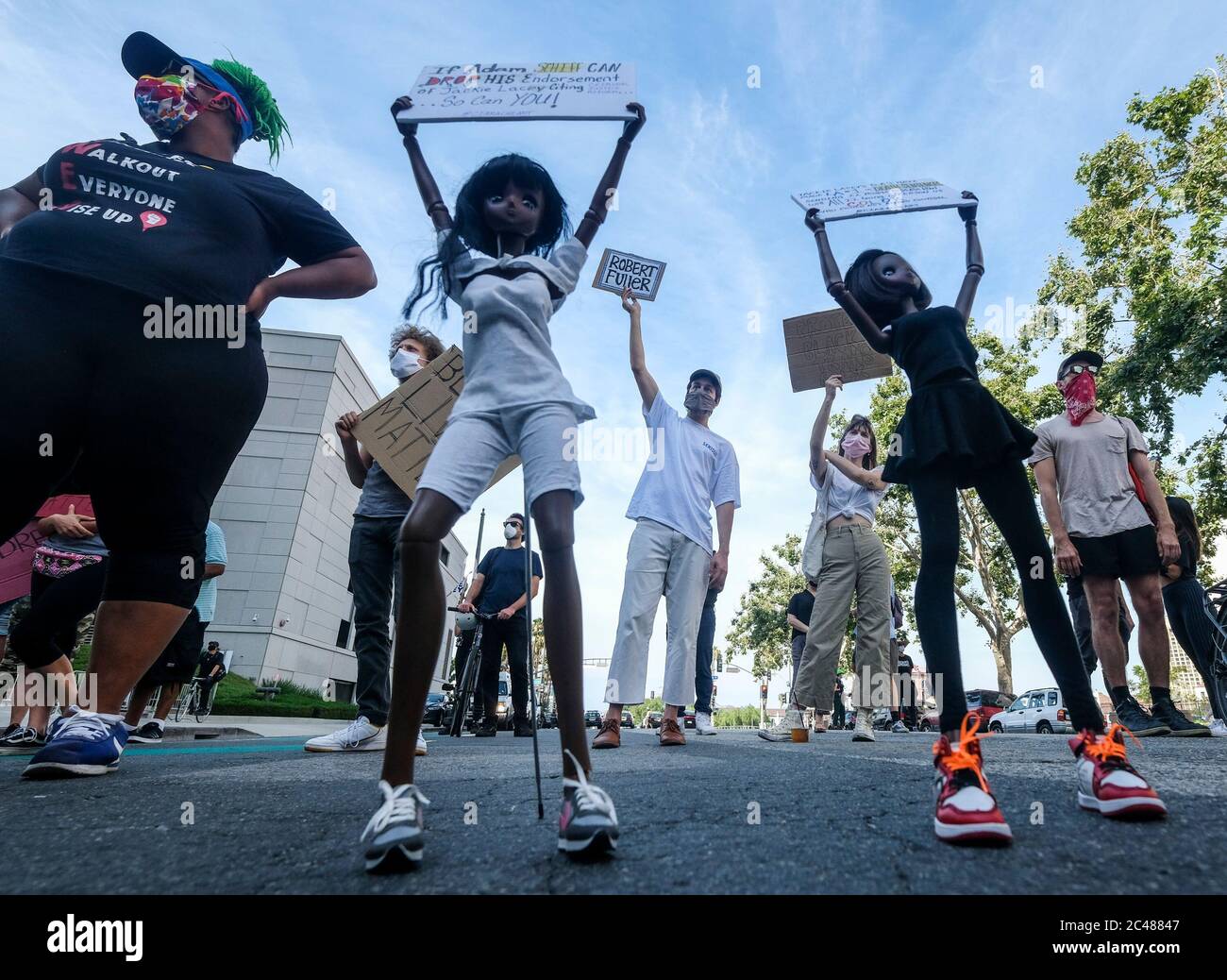 Los Angeles, California, USA. 24th June, 2020. Dolls holding signs as ...