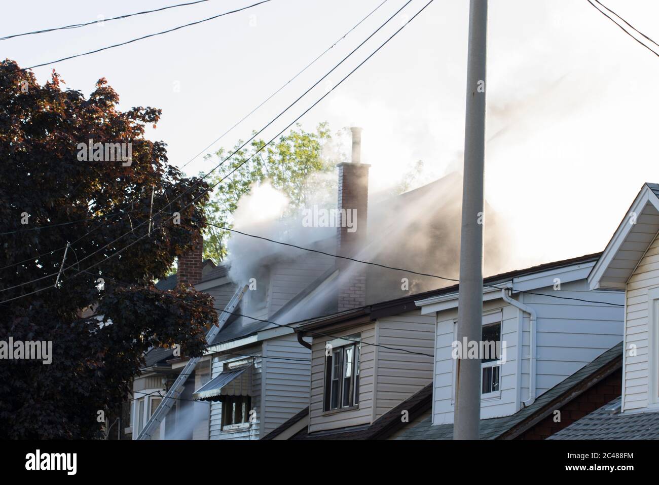 Smoke from house on fire early morning residential fire with thick ...
