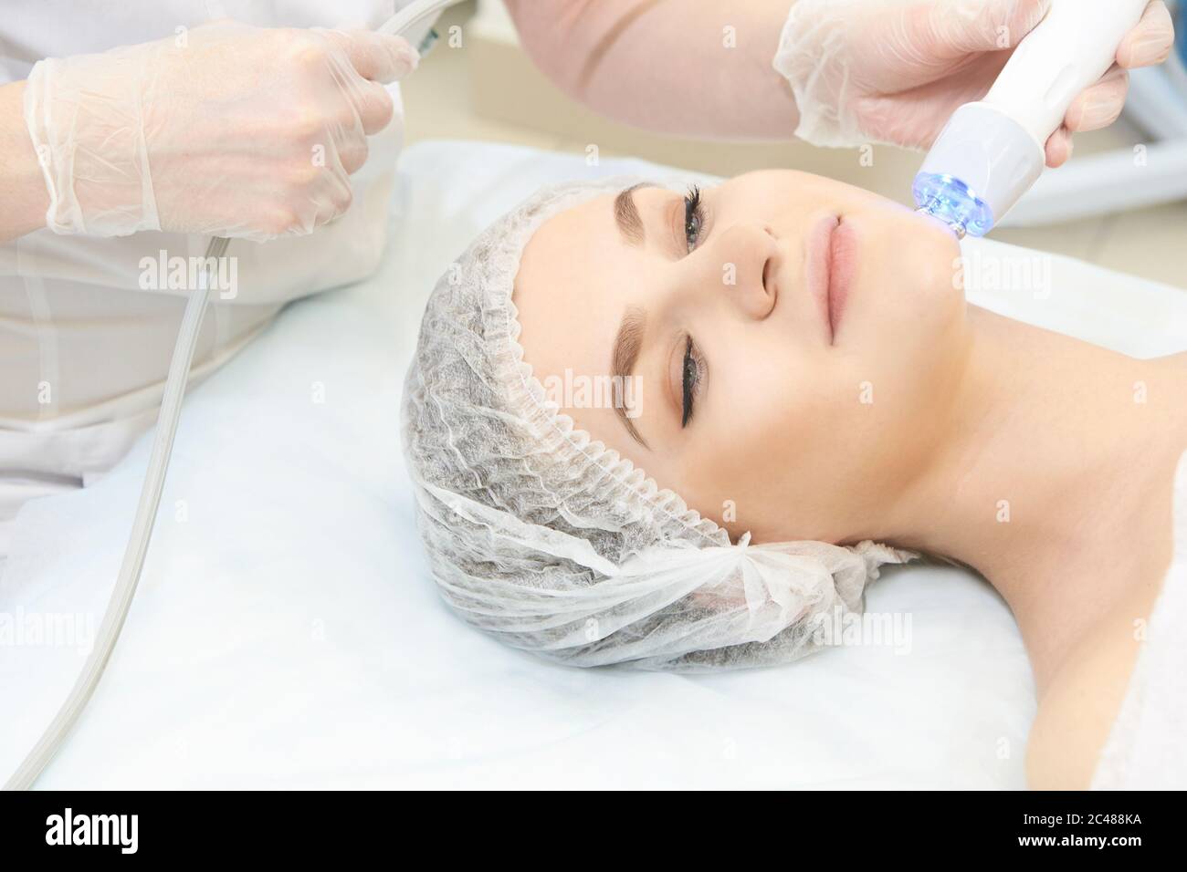 Microcurrent facial dermatology procedure. Model. Aesthetic ...
