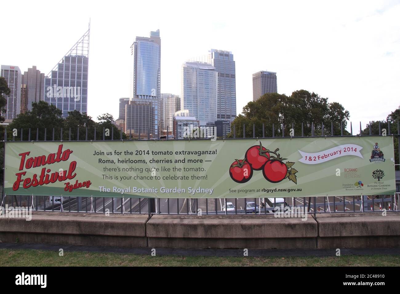 A banner across a road in front of the Sydney CBD promotes the Sydney ...