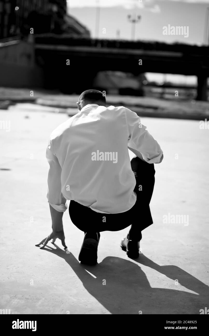 Touching the ground Black and White Stock Photos & Images - Alamy