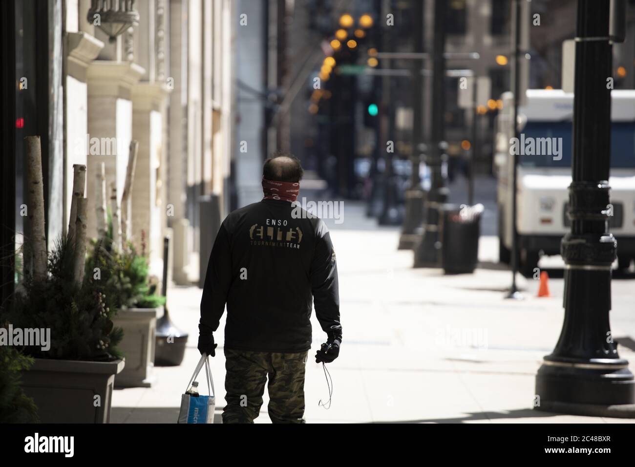 CHICAGO, UNITED STATES - Apr 18, 2020: People are walking the streets ...