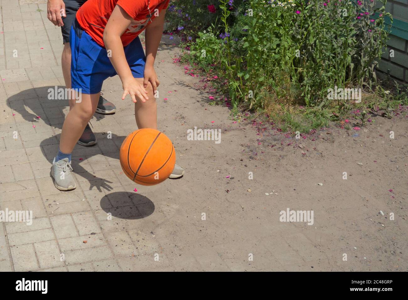 Boy bouncing ball hi-res stock photography and images - Alamy