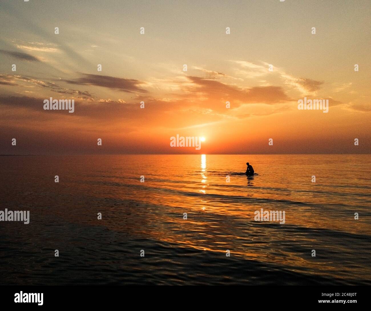 people in the sunset beach Stock Photo - Alamy