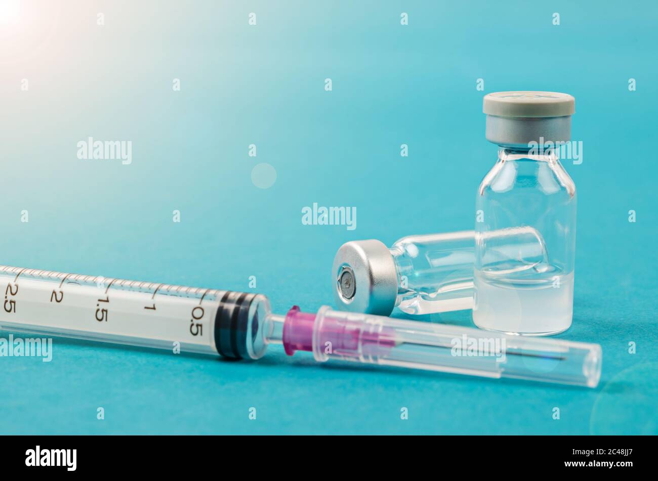 Vaccine vial dose with needle syringe, medical concept vaccination in ...