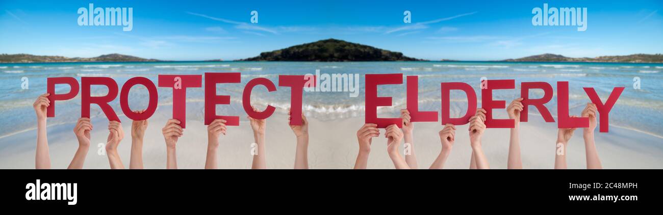 People Hands Holding Word Protect Elderly, Ocean Background Stock Photo ...