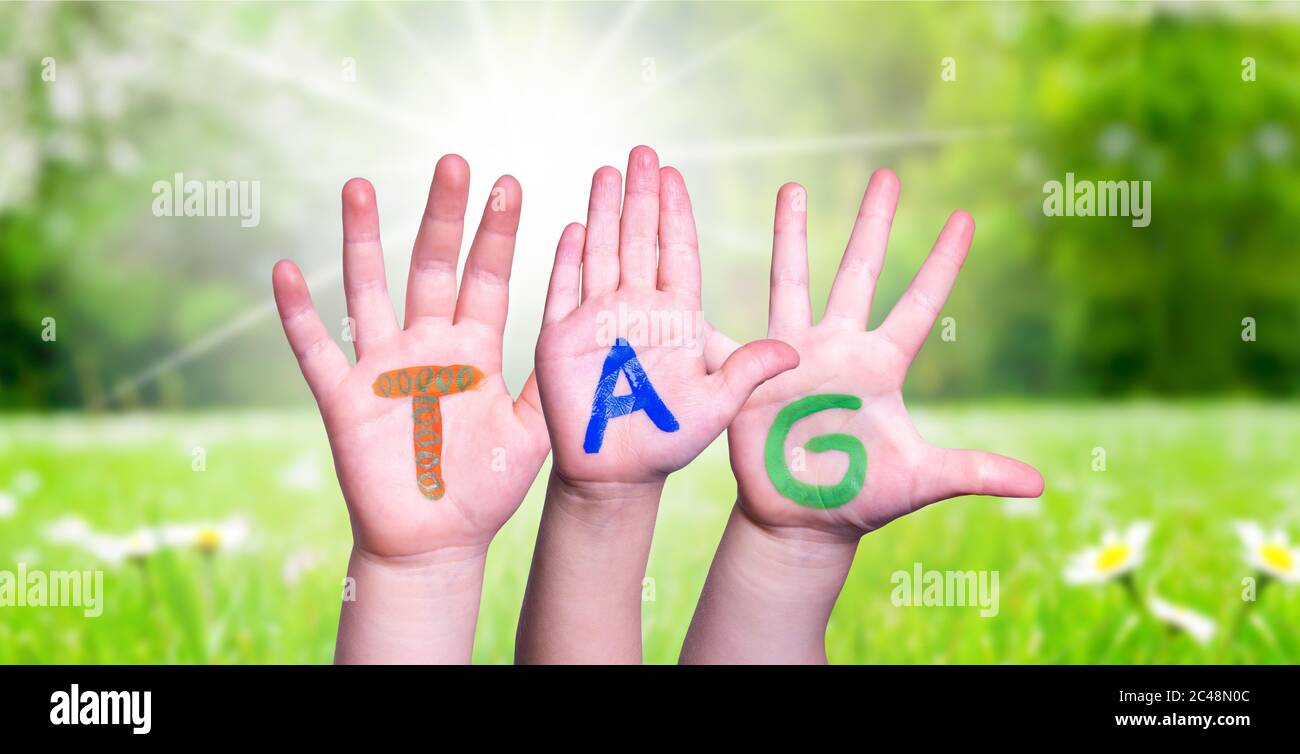 Children Hands Building Word Tag Means Day, Grass Meadow Stock Photo ...