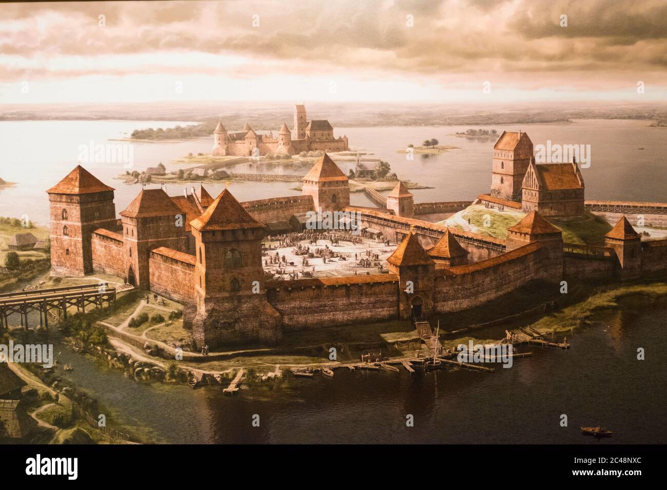 Detail of a large hitorical painting. Overview of Trakai castle. At ...