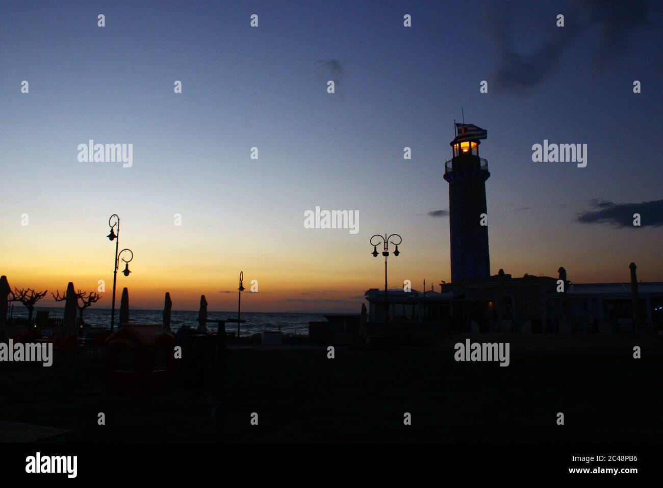 The lighthouse of Patras, with a Greek flag Stock Photo - Alamy