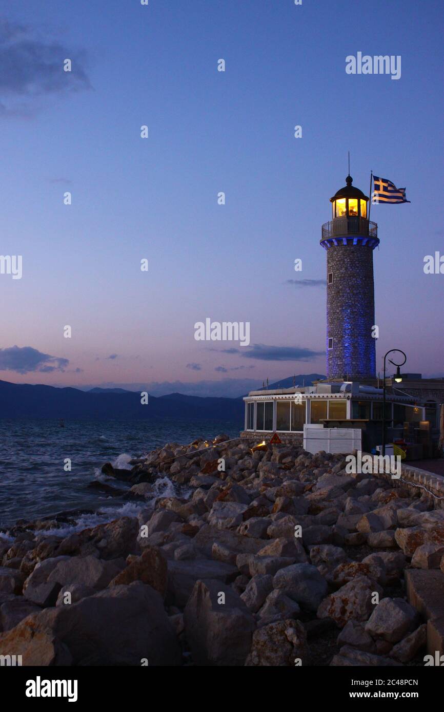 The lighthouse of Patras, with a Greek flag Stock Photo - Alamy