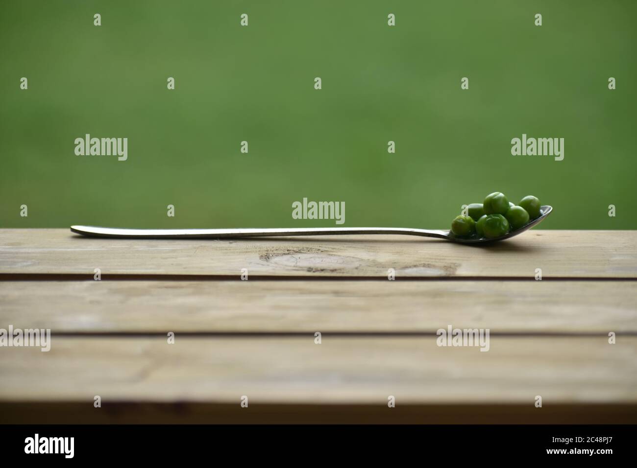 Closeup photograph of boiled Peas in a spoon Stock Photo - Alamy
