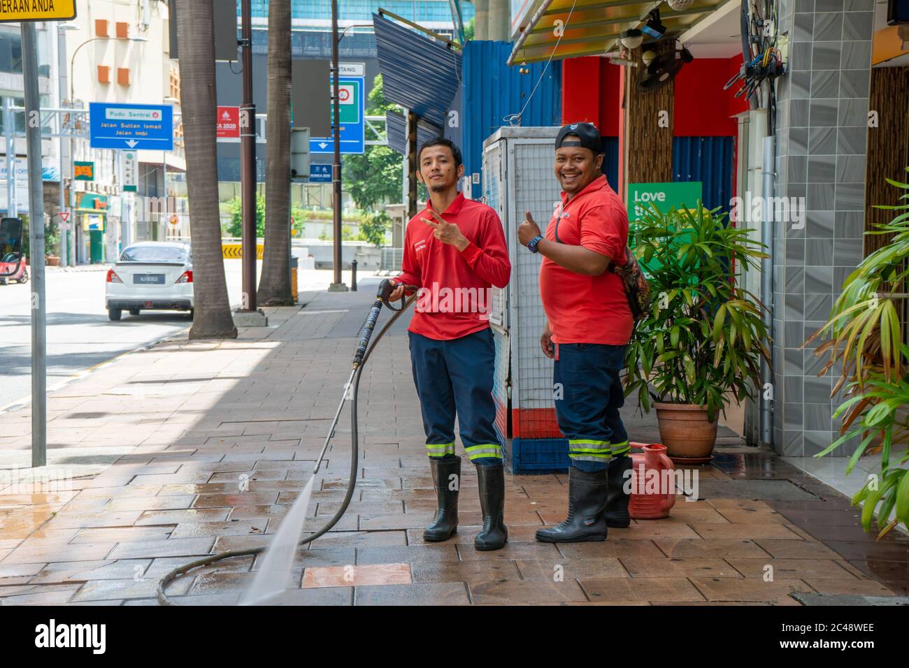 Cleaning streets with jet washer hi-res stock photography and images ...