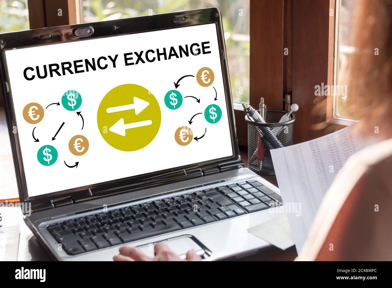 Laptop screen showing currency exchange concept Stock Photo - Alamy