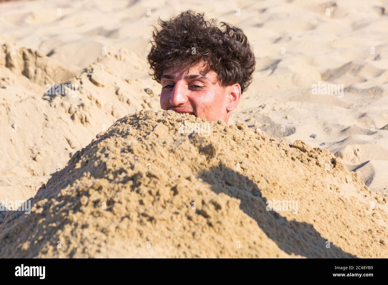 Buried up to neck hi-res stock photography and images - Alamy