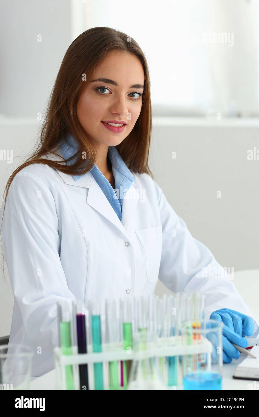 Charming female doctor doing laboratory tests in clinic Stock Photo - Alamy
