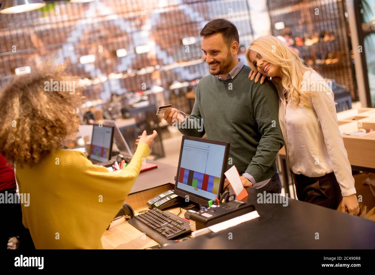 Male clothes shop assistant hi-res stock photography and images - Alamy