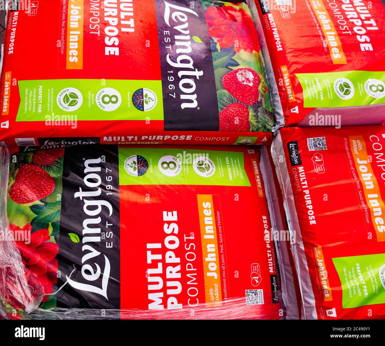 A stack of bags of Levington multi purpose Compost in a garden centre ...
