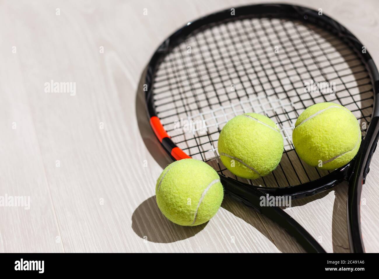 Tennis concept with the balls and racket Stock Photo - Alamy