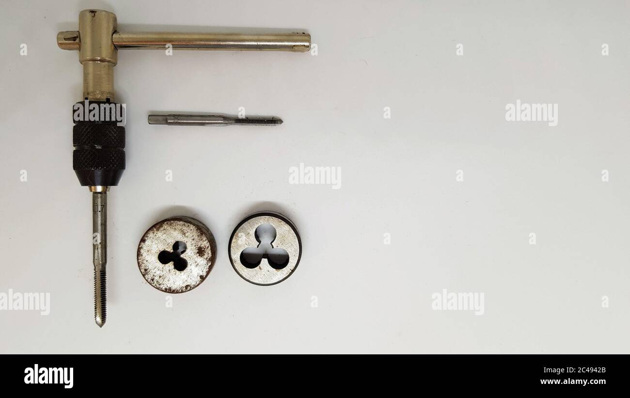 Overhead shot of several components of a drill machine Stock Photo - Alamy