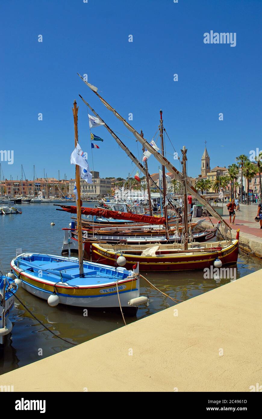 Traditional and colorful fishing boats in the port of Sanary-sur-Mer in ...