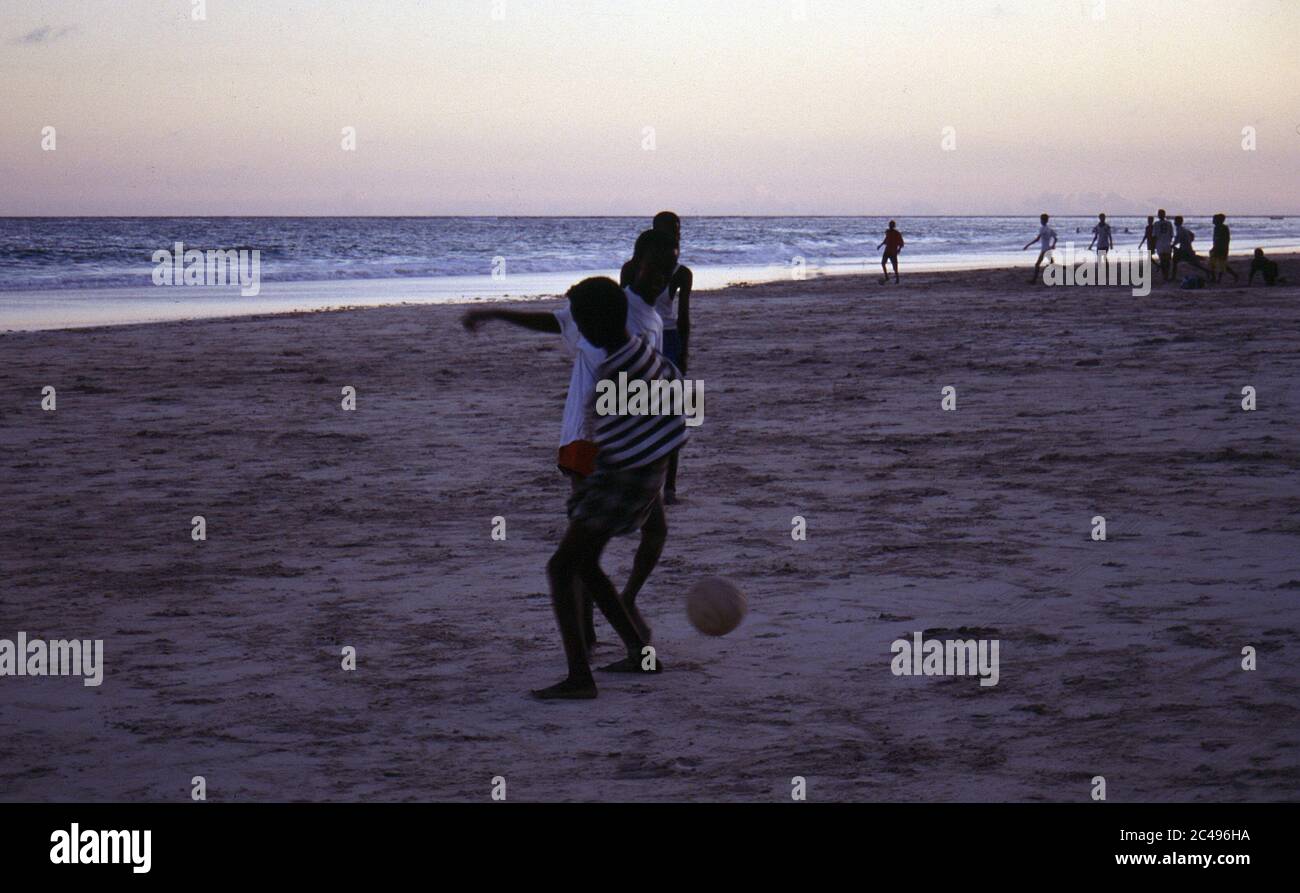 Children playing football on the beach at sunset in Kismayo Somalia ...