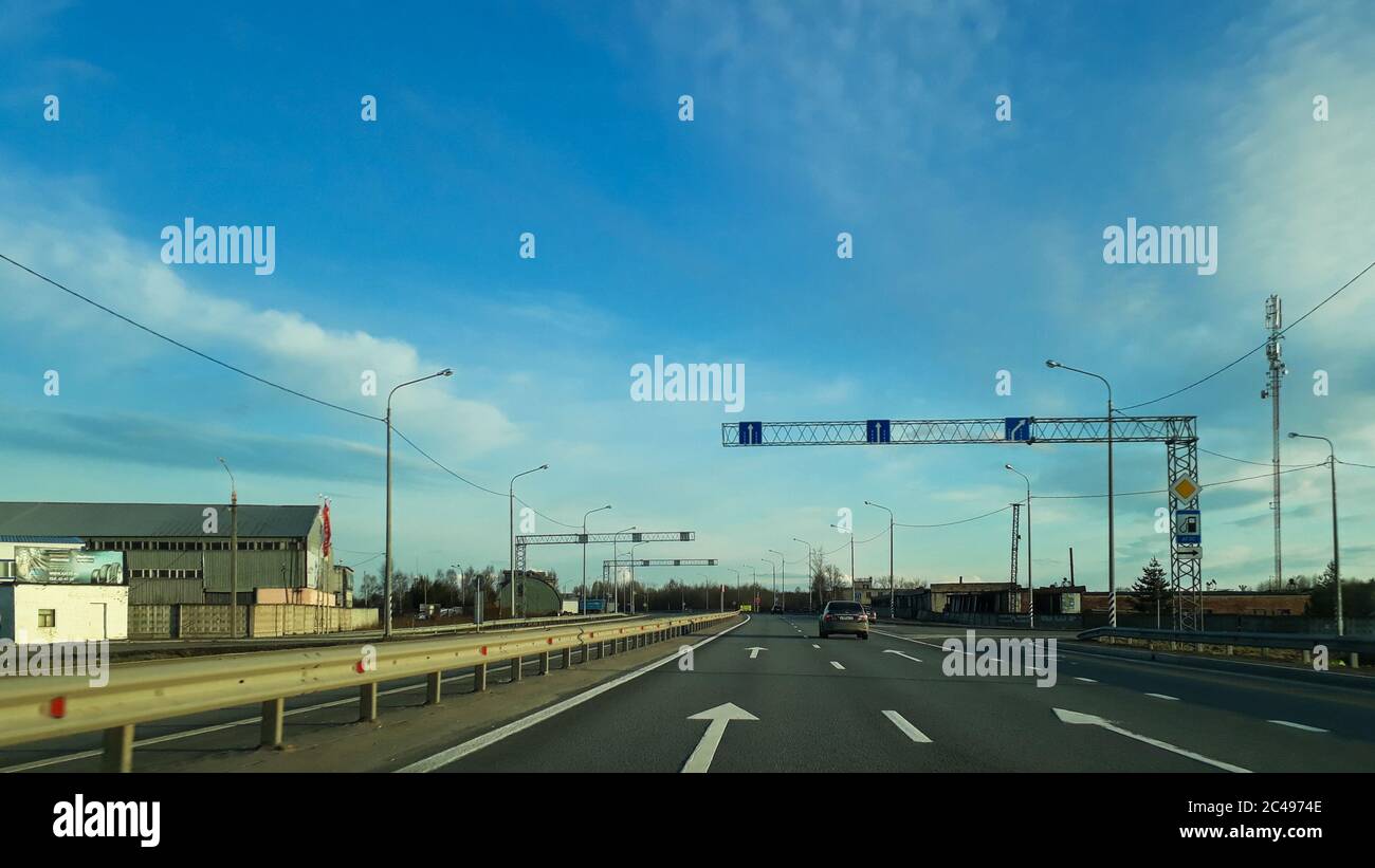 A road or highway leading to the horizon. View from the car window ...