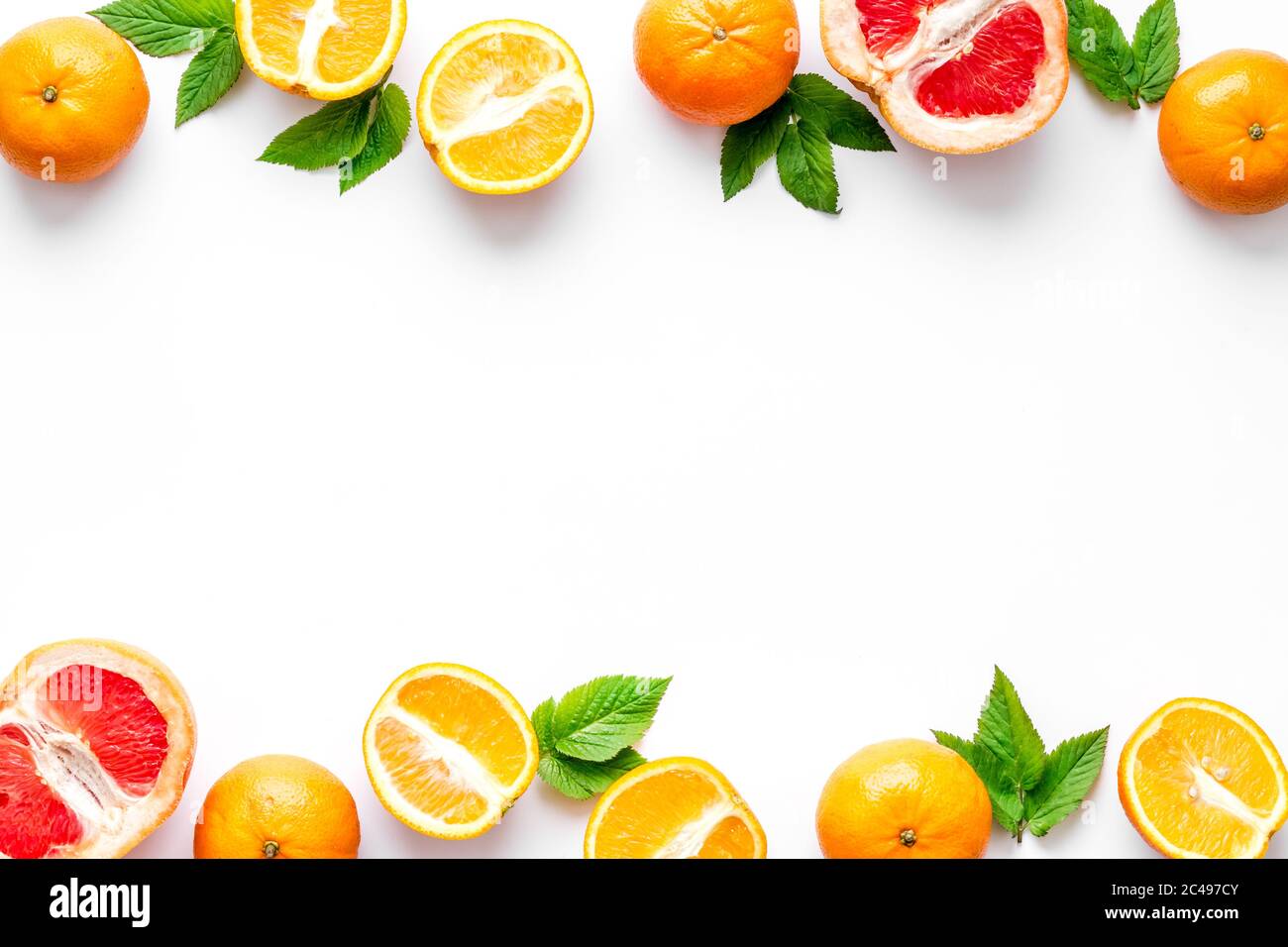 Frame sliced citrus mix white background top view Stock Photo - Alamy