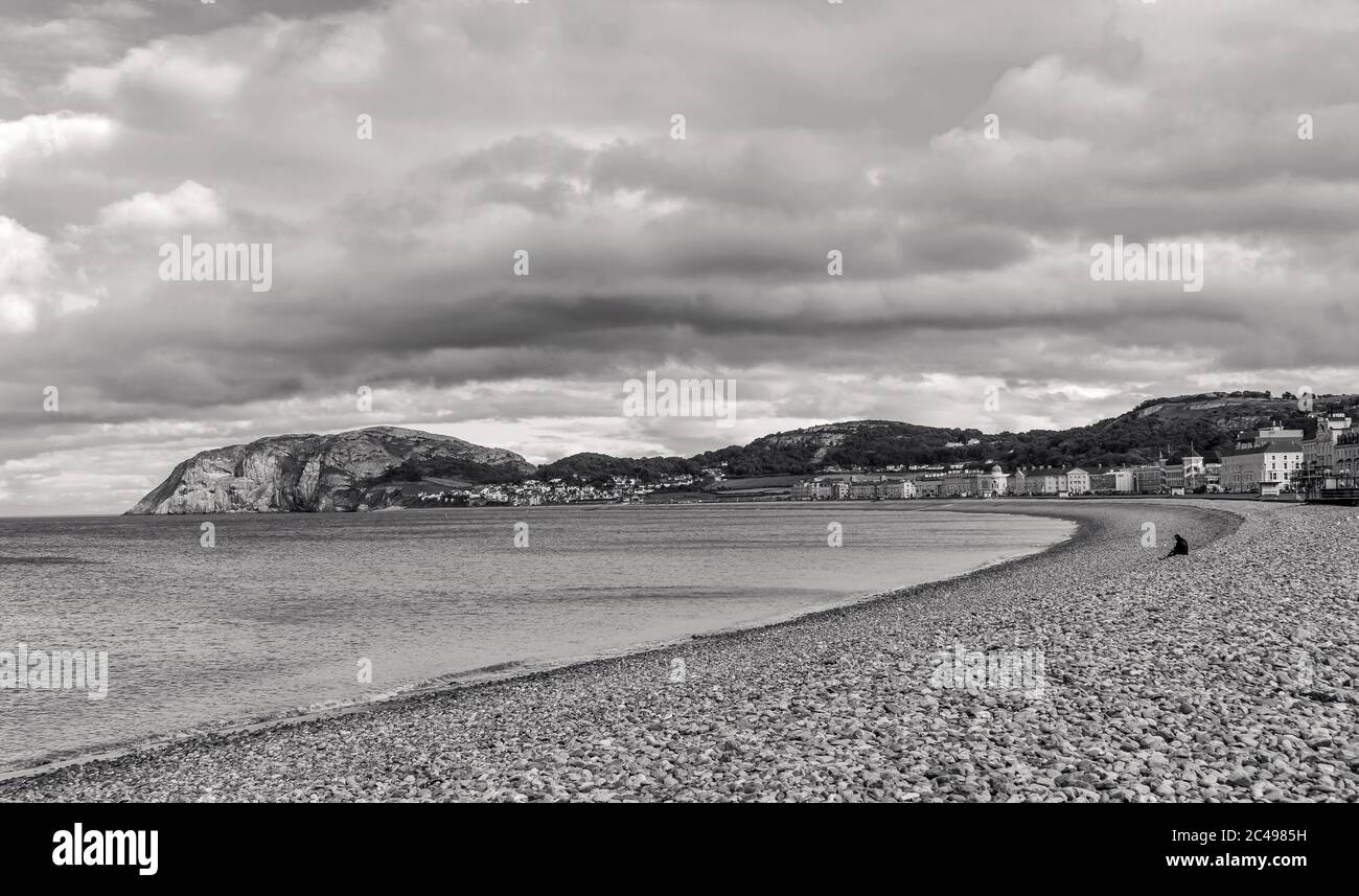 A view of Llandudno’s curving shoreline with dramatic clouds. The ...