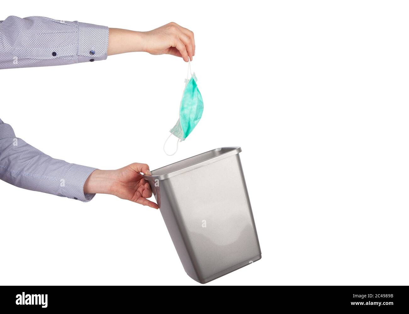 Useless coronavirus face mask as junk - Man hands holding plastic trash ...