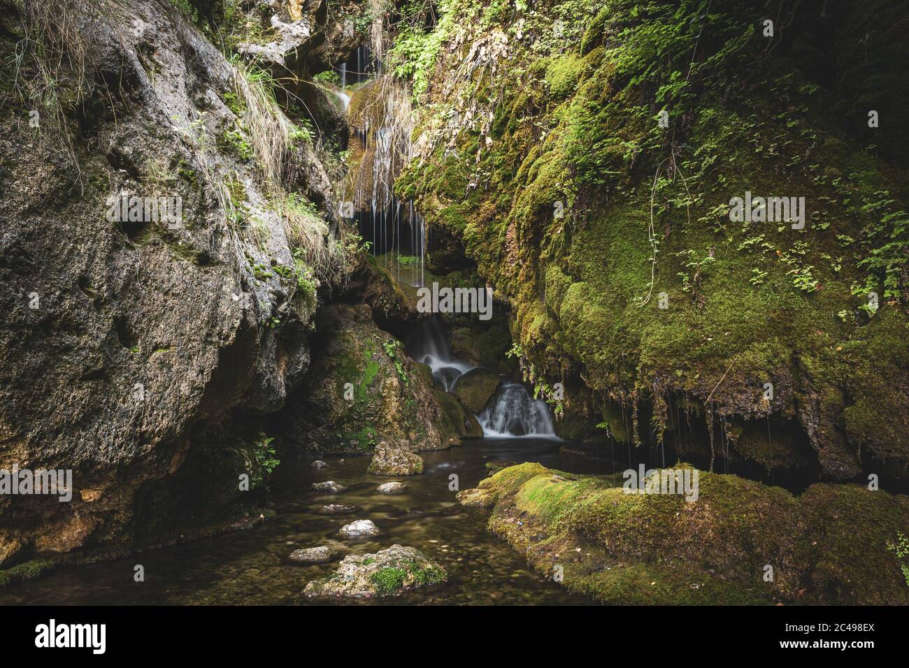 A beautiful shot of a canyon with a small waterfall Stock Photo - Alamy