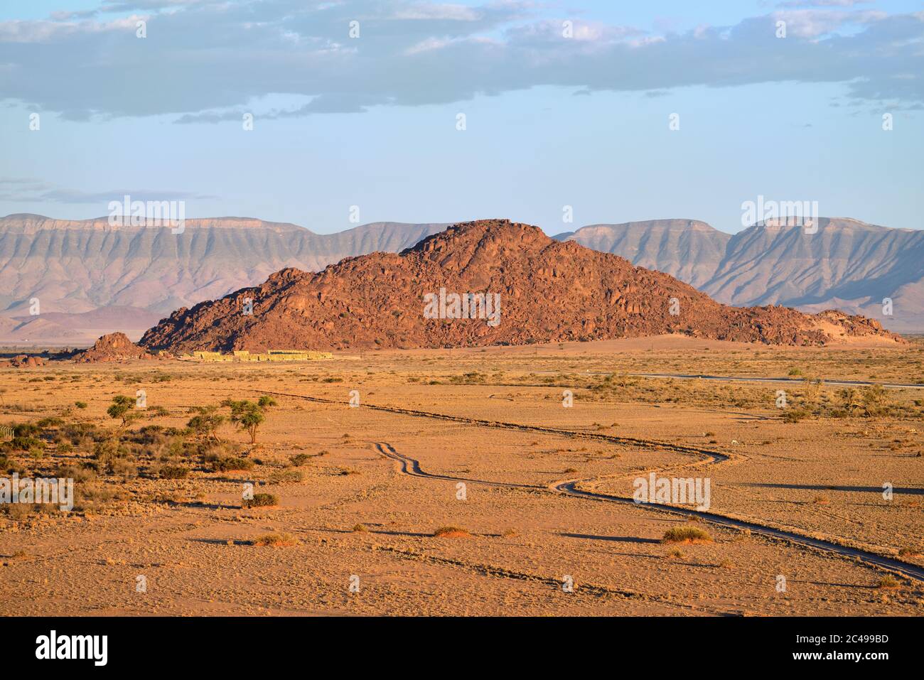 Beautiful namibian landscape with a dike is a large slab of rock ...